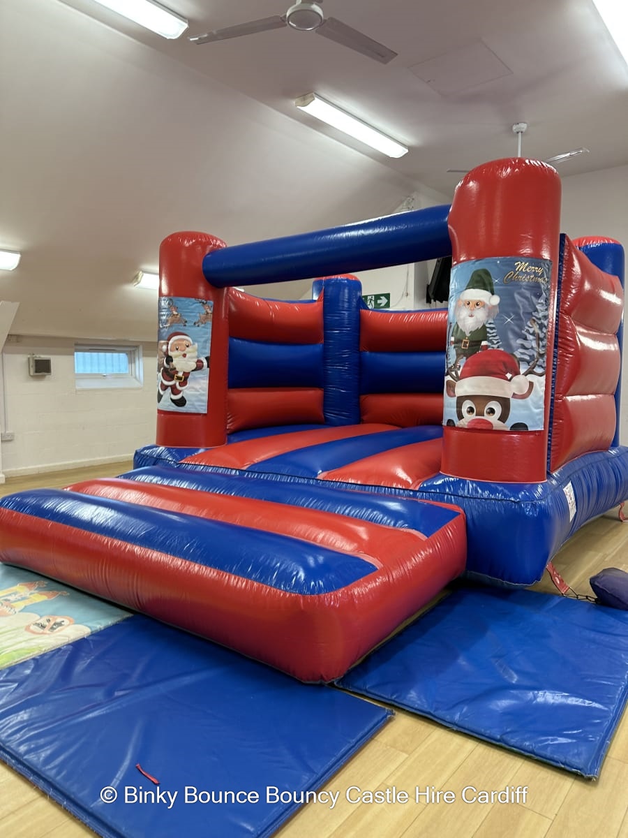 Christmas Theme Blue/Red Low Height Bouncy Castle - Bouncy Castle Hire ...