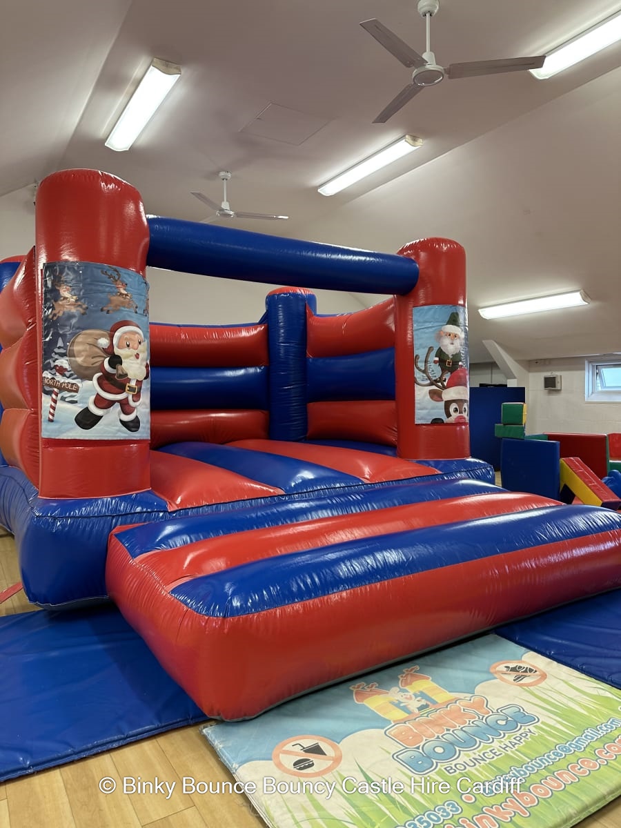 Christmas Theme Blue/Red Low Height Bouncy Castle - Bouncy Castle Hire ...